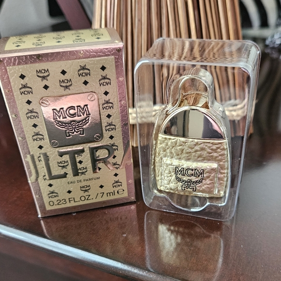 M C M | Accessories | Mcm Ultra Fragrance Neckbag Charm | Poshmark